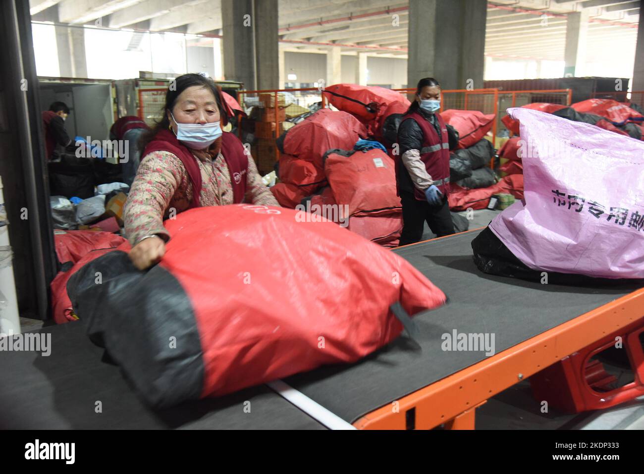 LIANYUNGANG, CHINA - NOVEMBER 8, 2022 - Employees of YTO Express sort ...