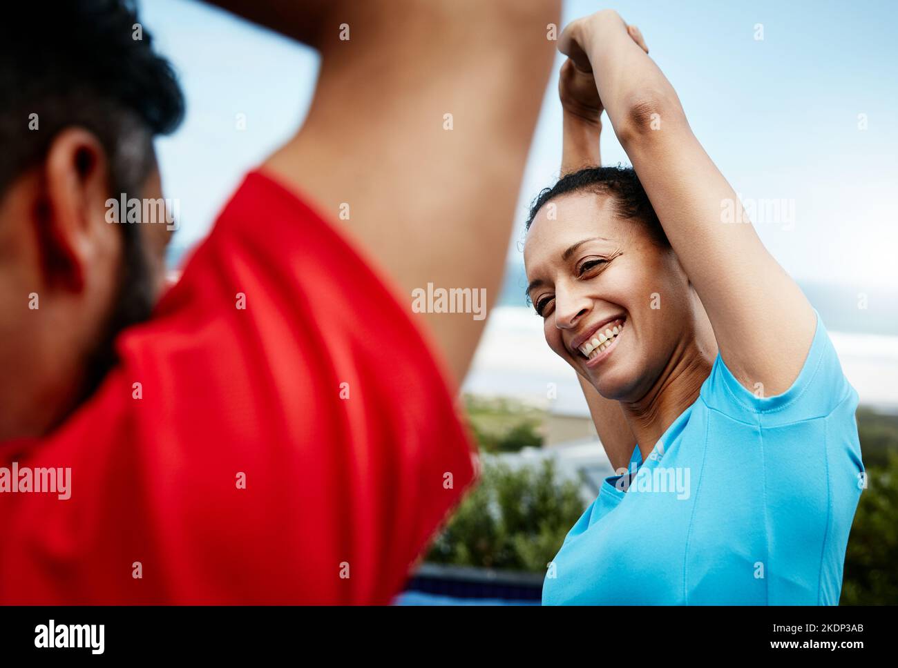 Lets loosen up those muscles. a couple stretching before their workout ...