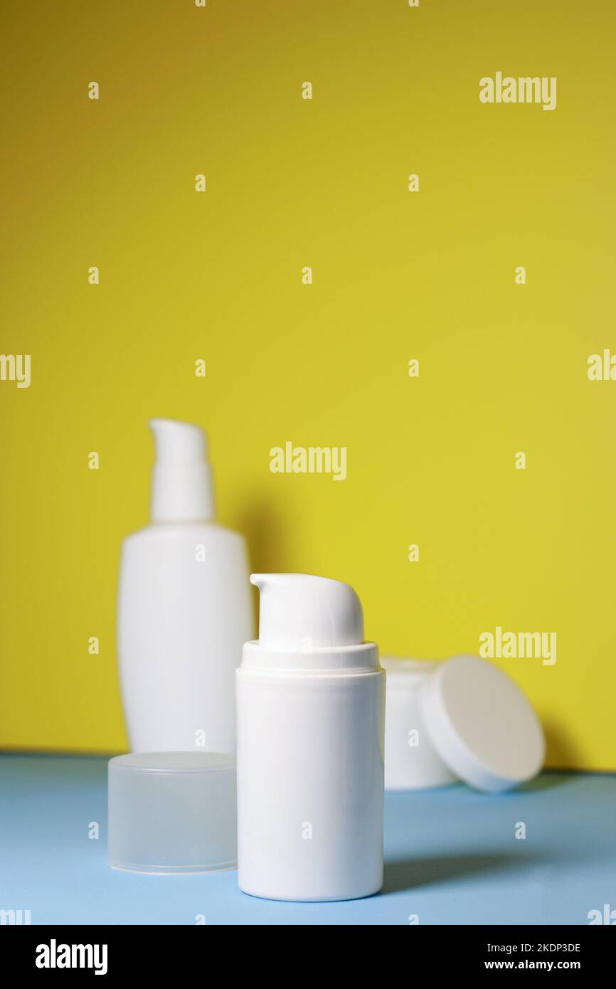 mock up of white jar of cream on a yellow background. Ready place for ...