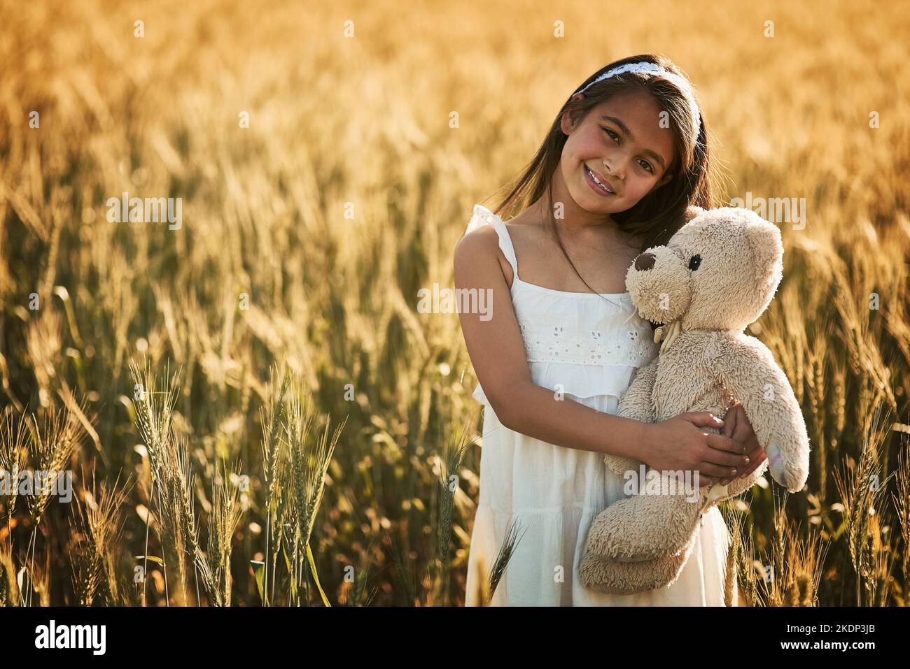Childhood is the most beautiful of all lifes seasons. Portrait of a cute little girl playing ...