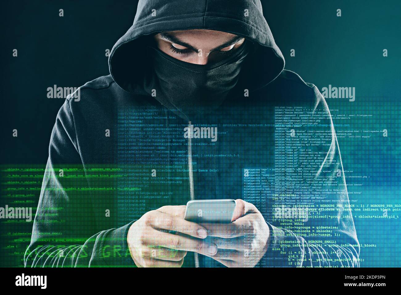 This hacker moves with the times. a computer hacker using a smartphone while standing against a ...