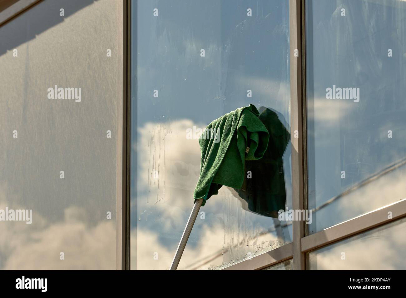 window washing, washing a street shop window Stock Photo - Alamy
