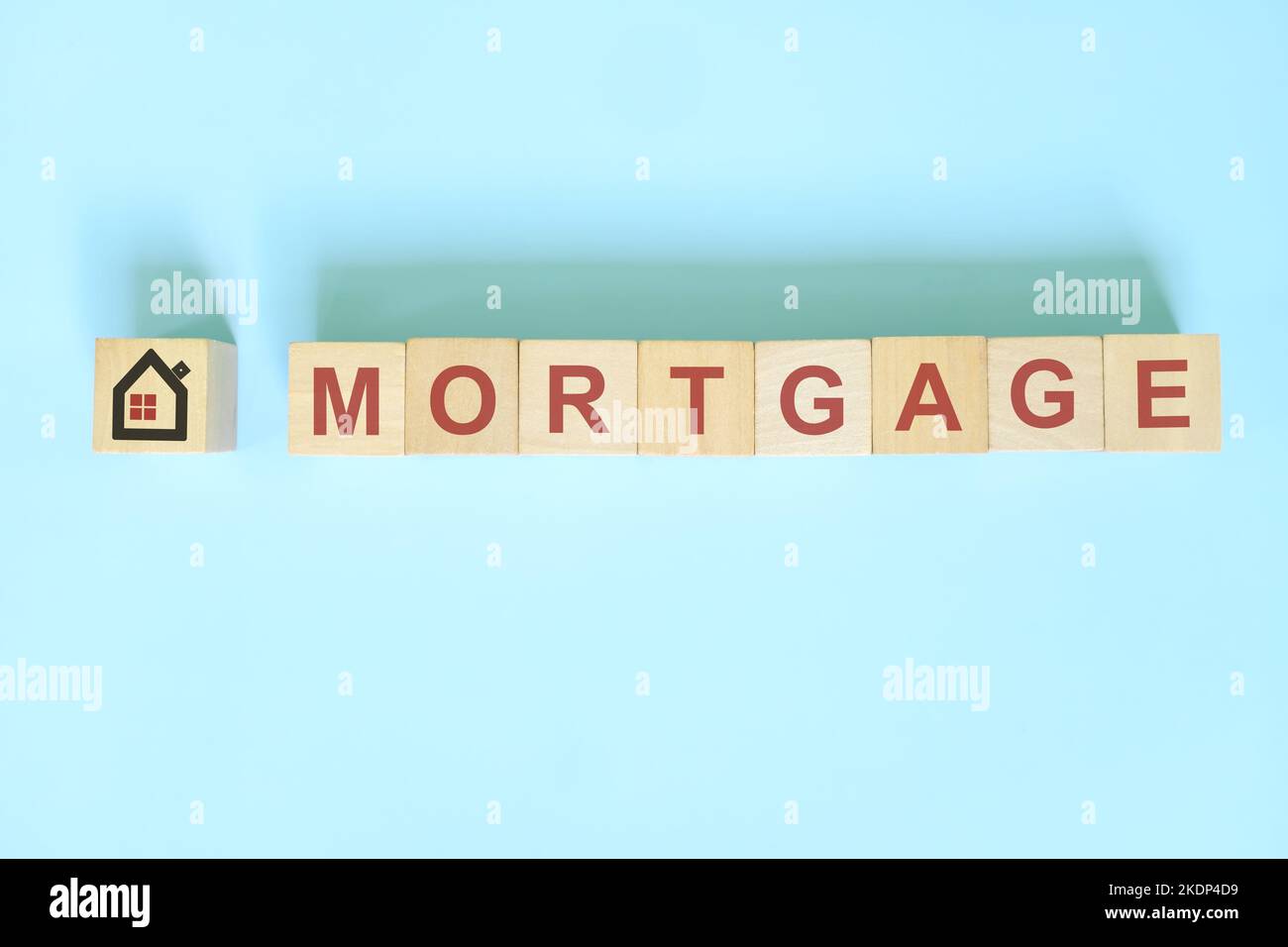 Housing and property mortgage loan concept in real estate. Wooden ...