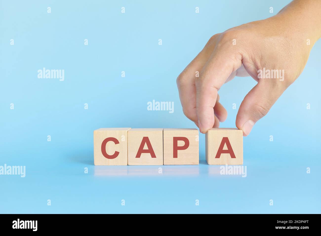 CAPA or corrective and preventive action on wooden blocks in blue ...