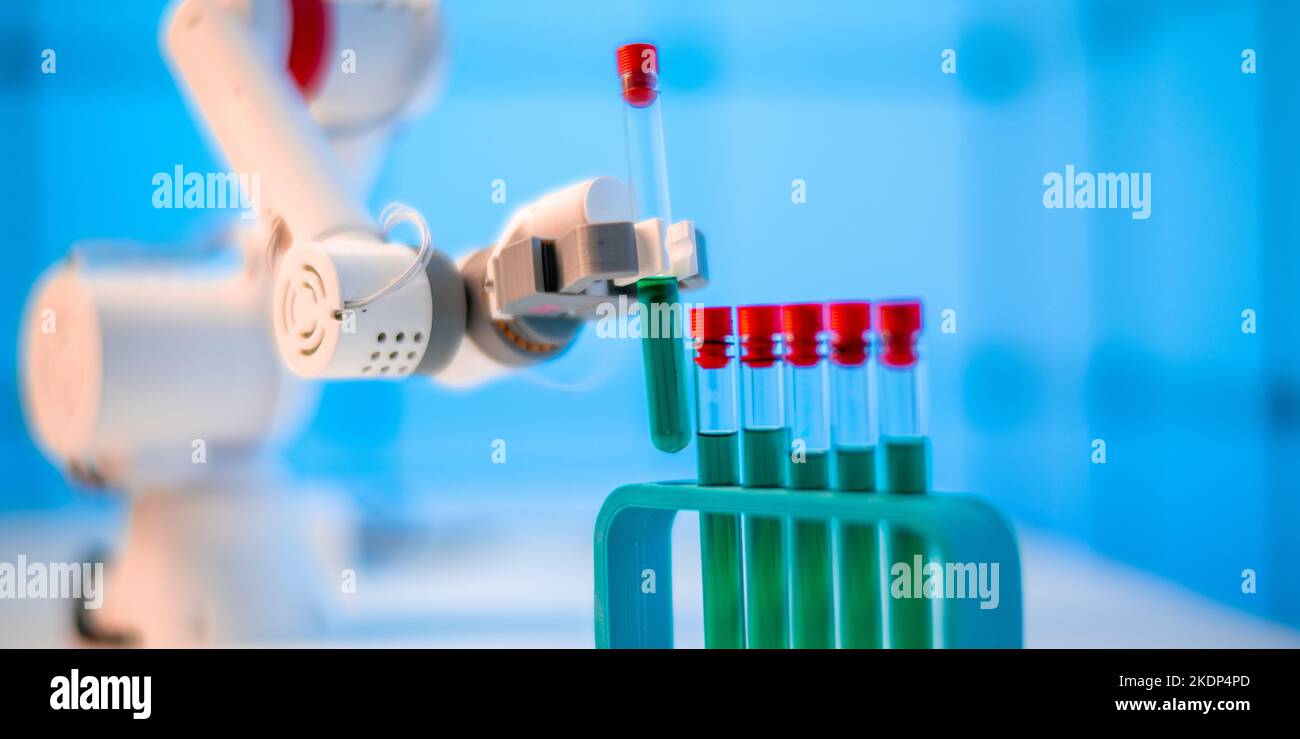 Robot take a test tube with a liquid from Test tube rack in a ...