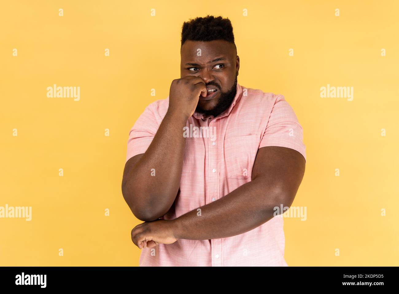 Anxiety disorder. Portrait of stressed out worried man in pink shirt ...