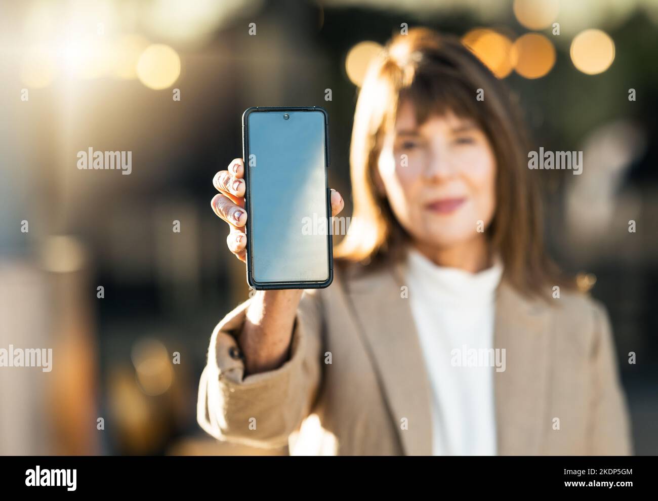 Hand phone outdoors hi-res stock photography and images - Alamy