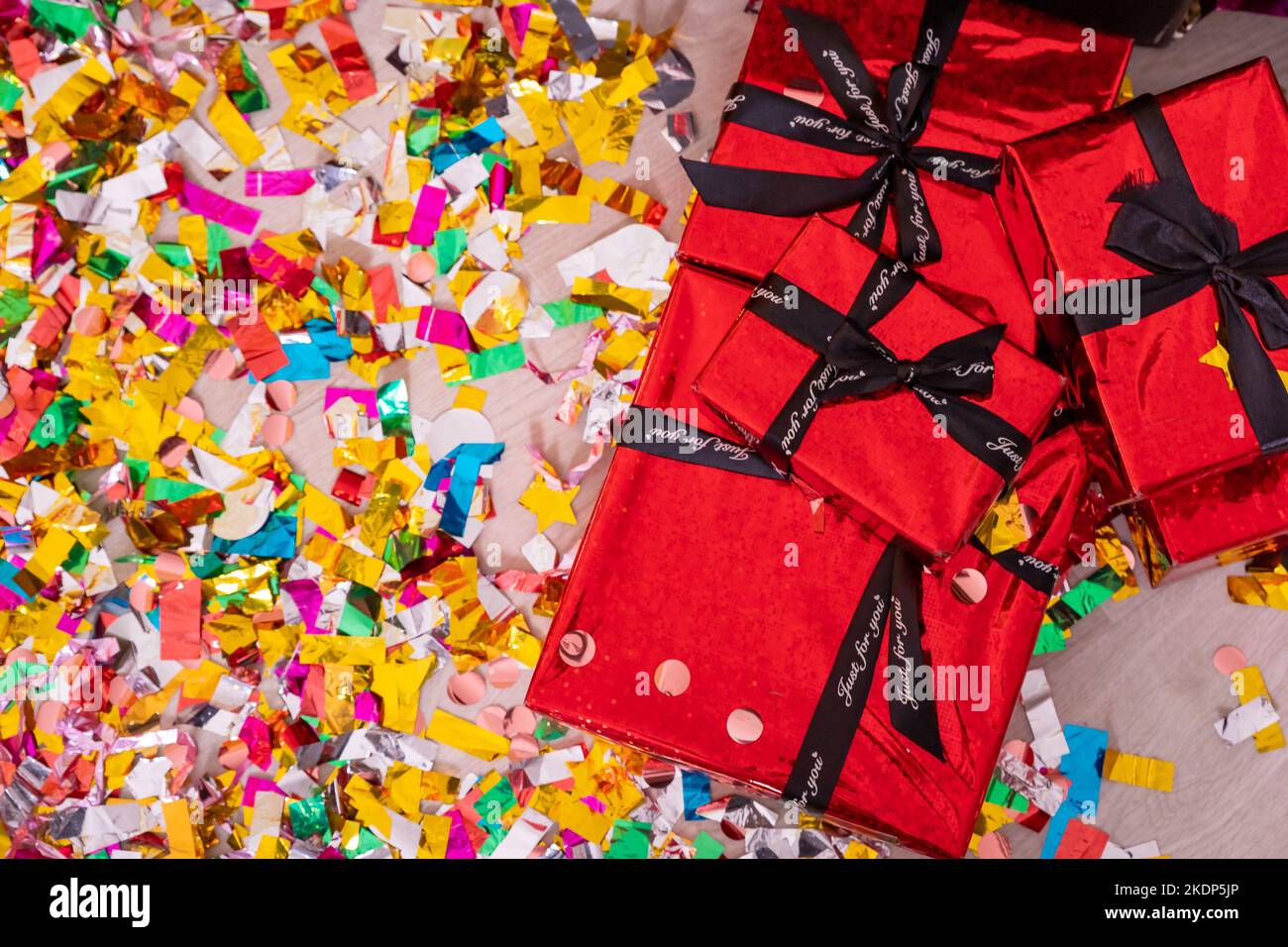 Christmas composition. colorful decorations, gifts on confetti ...