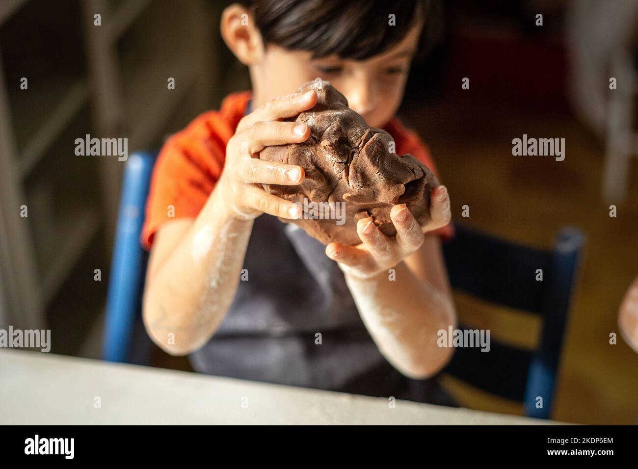 close up of child hands kneading the chocolate dough Stock Photo - Alamy