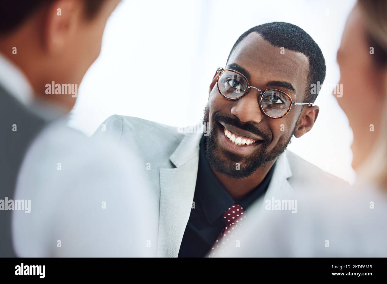 Youre in good health. a young financial advisor meeting with his ...