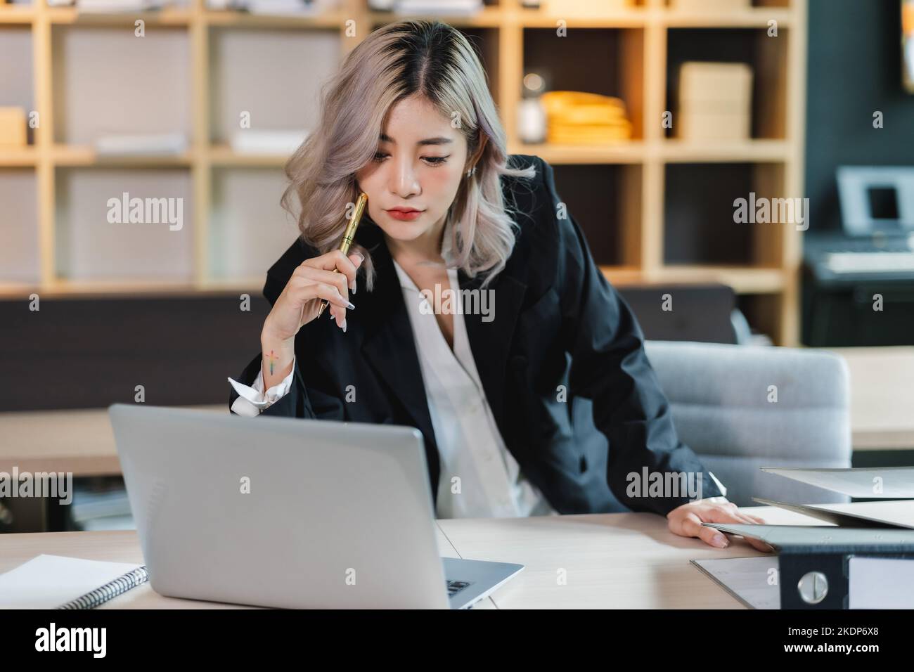 Asian beautiful businesswoman seriously working thinking idea for work ...