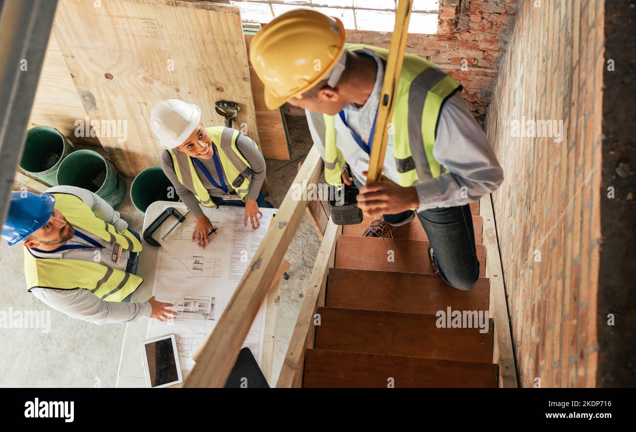 Top view, construction building and team planning with blueprint ...