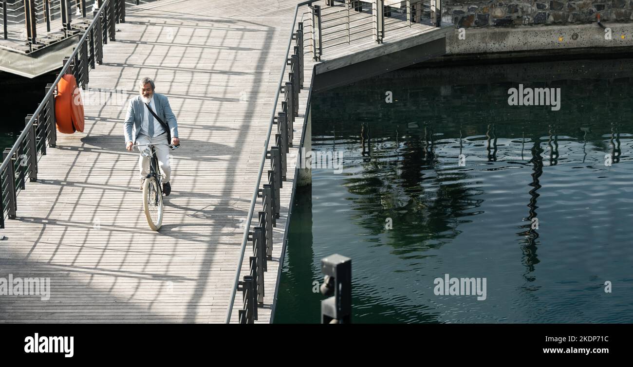 Businessman, asian and eco bike travel on bridge for carbon neutral ...