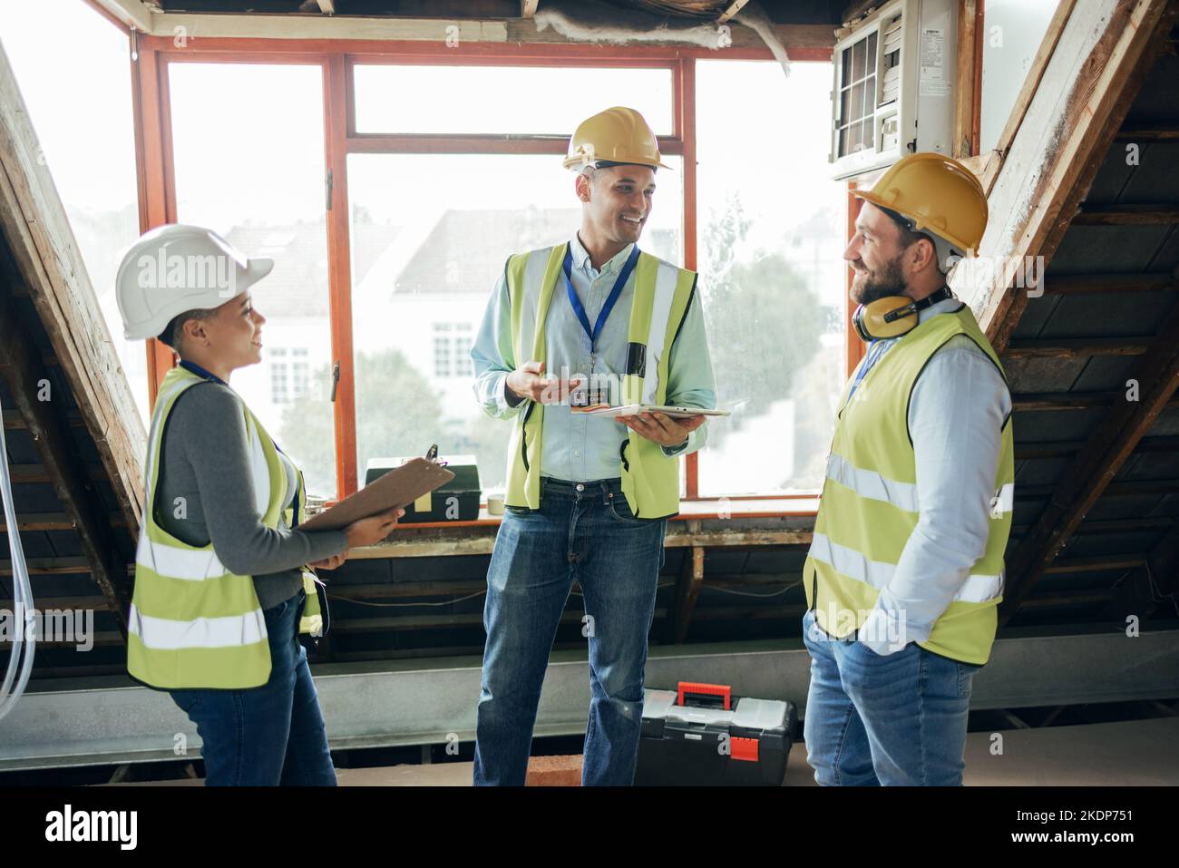 Teamwork, planning and engineers talking at construction site for ...