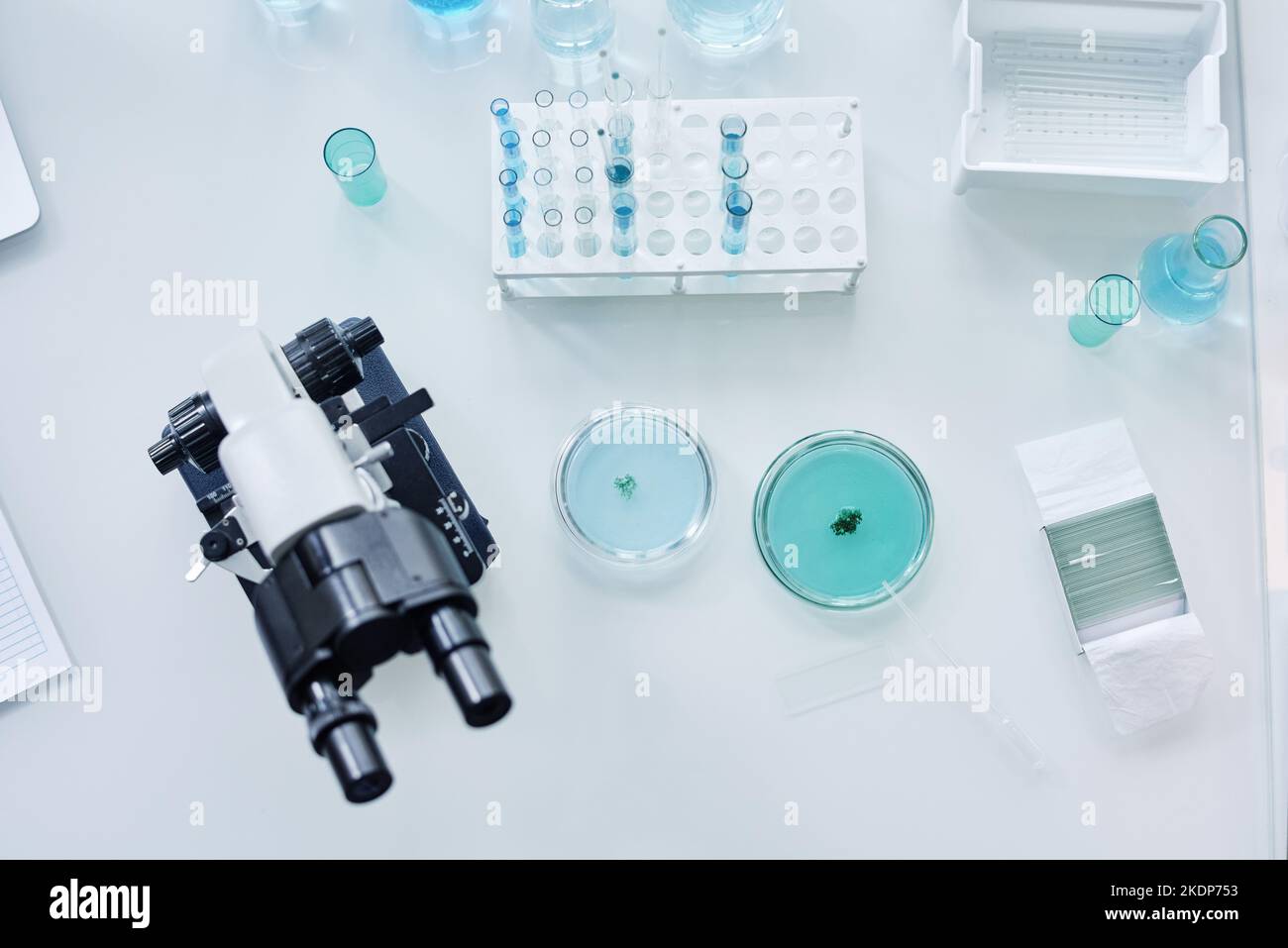 Above view of glassware, microscope and other equipment for carrying ...