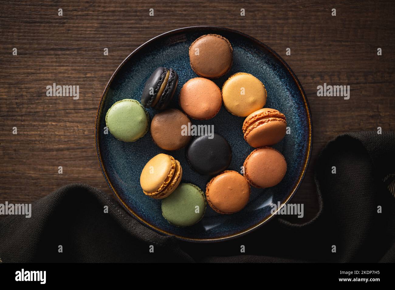 Sweet macaron dessert. Colorful macarons on the plate. Top view Stock ...