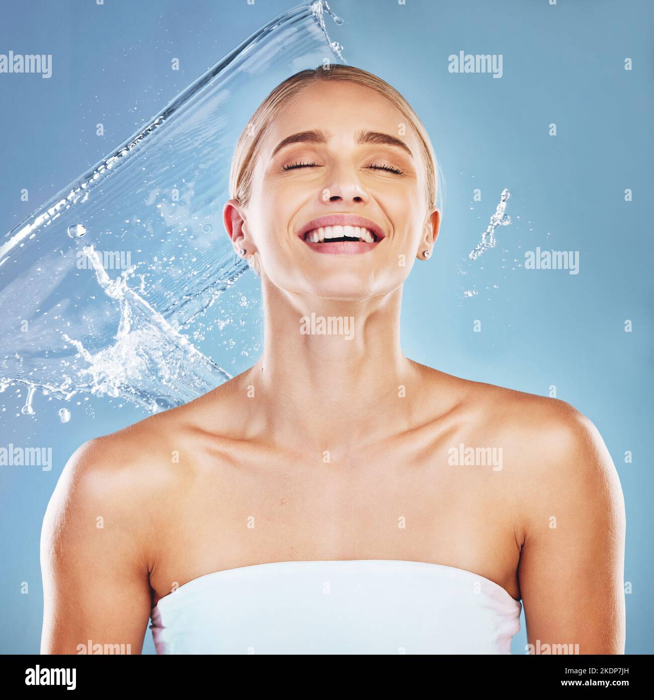 Water, beauty and cleaning with a model woman in studio on a blue ...