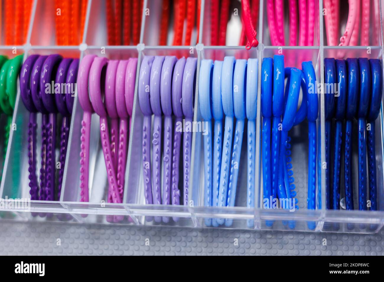 A set of colored elastic bands for installing braces in orthodontic ...