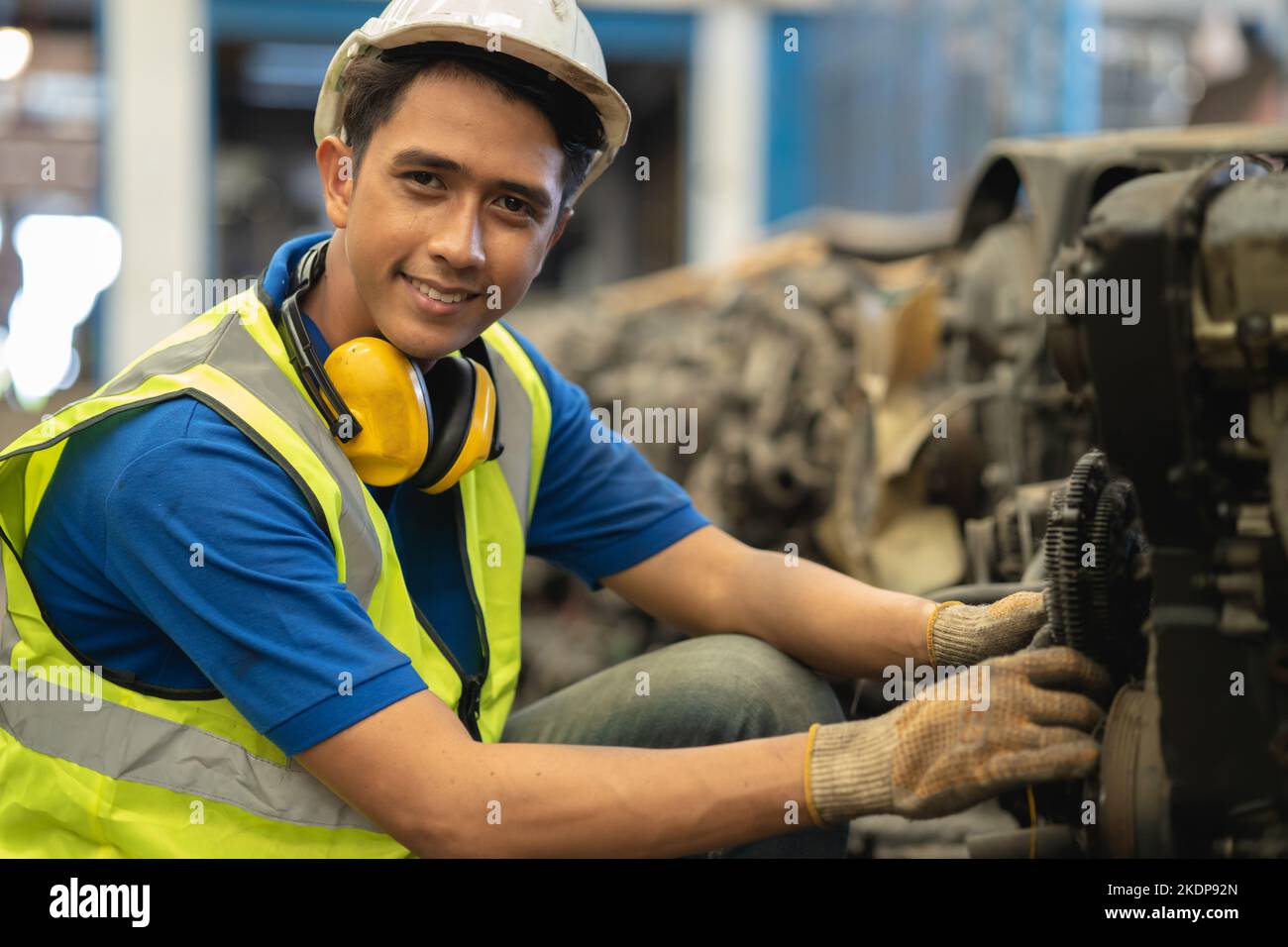 portrait young male worker engineer working in heavy industry with ...