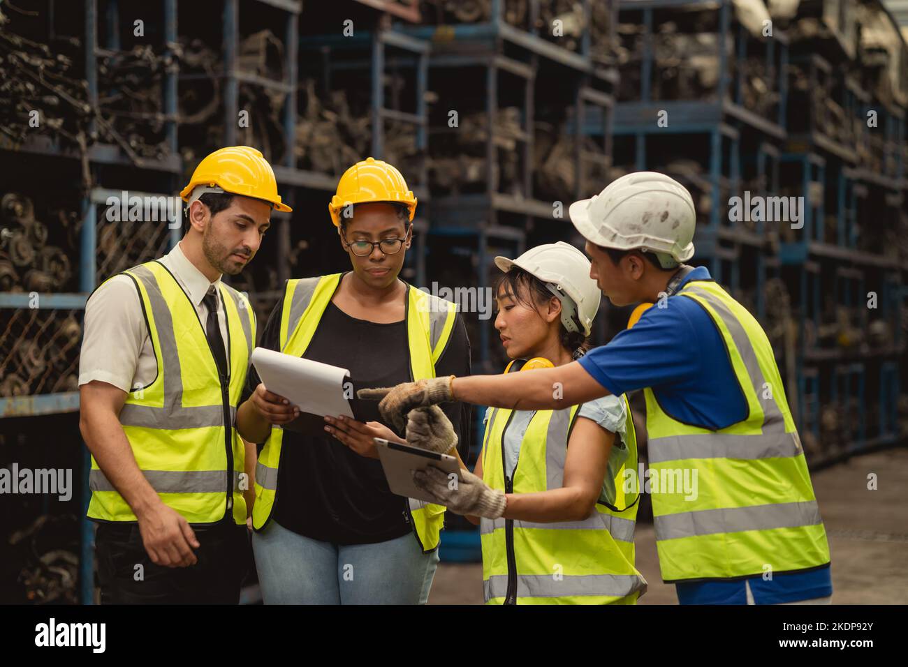 group of engineer industry worker team working together help solving ...