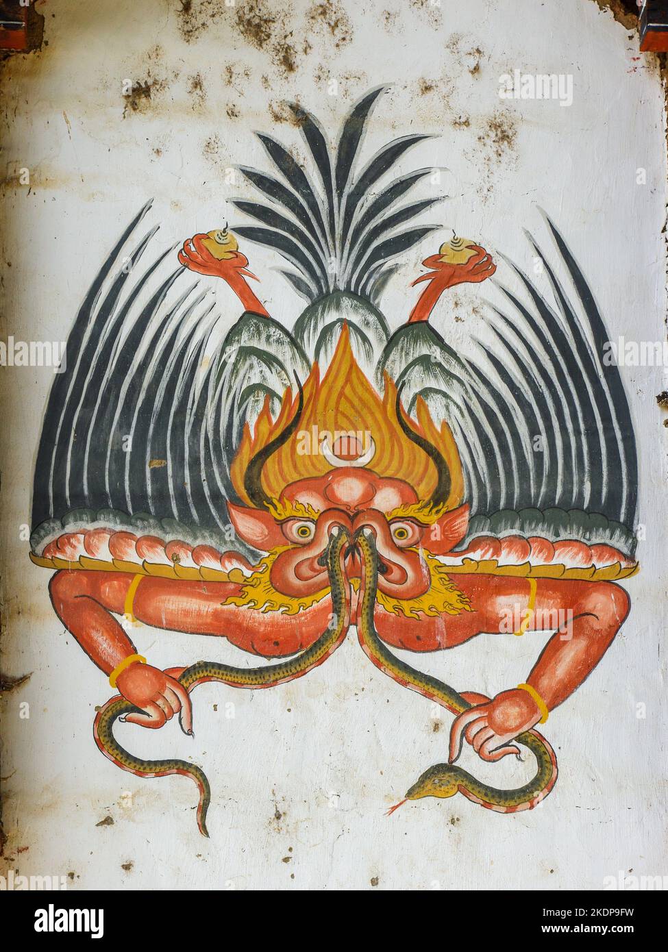 Colorful traditional wall painting of a Garuda fighting snake on ...
