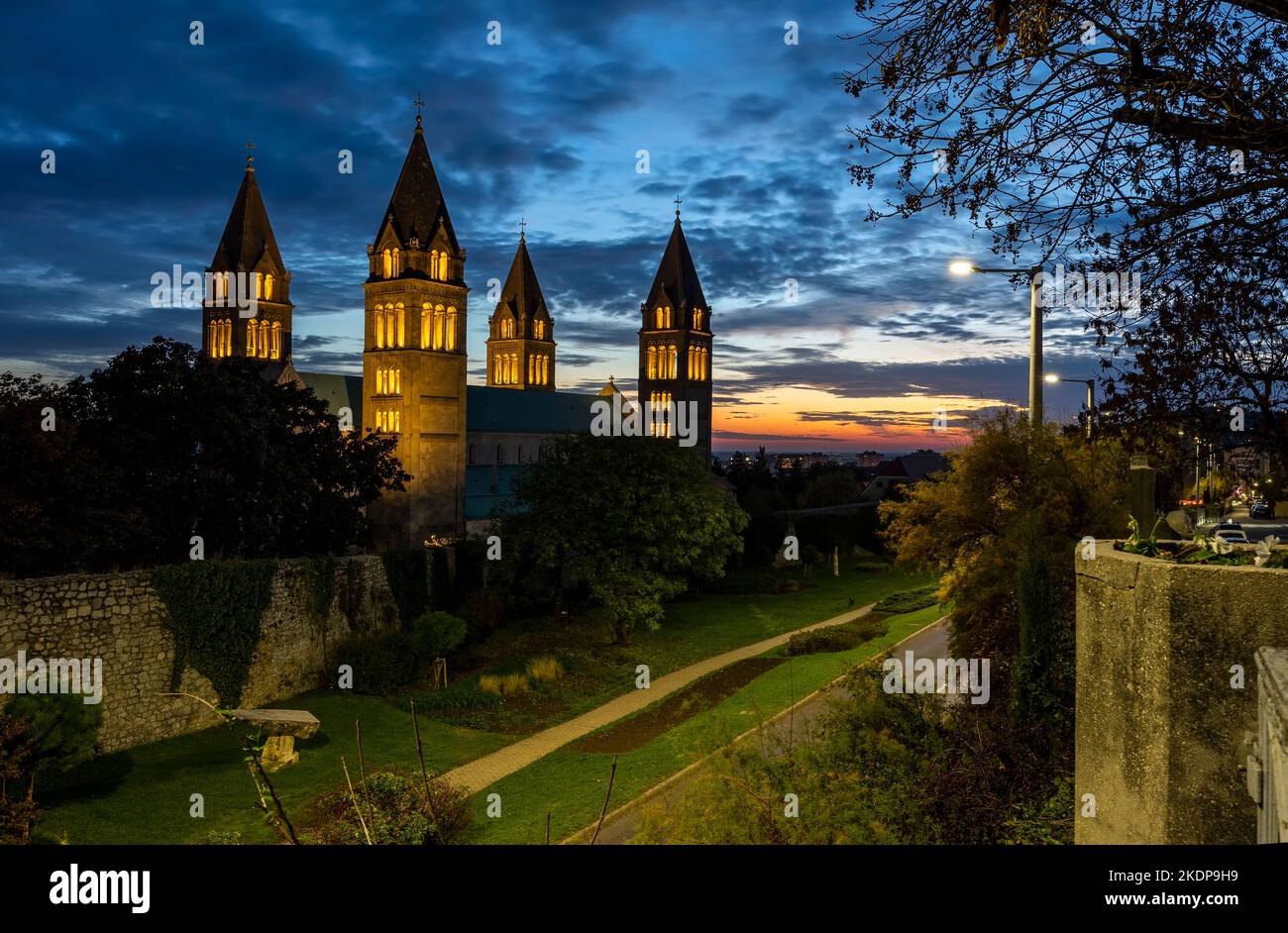 Four towers of christian cathedral at night in Pecs, Hungary Stock ...
