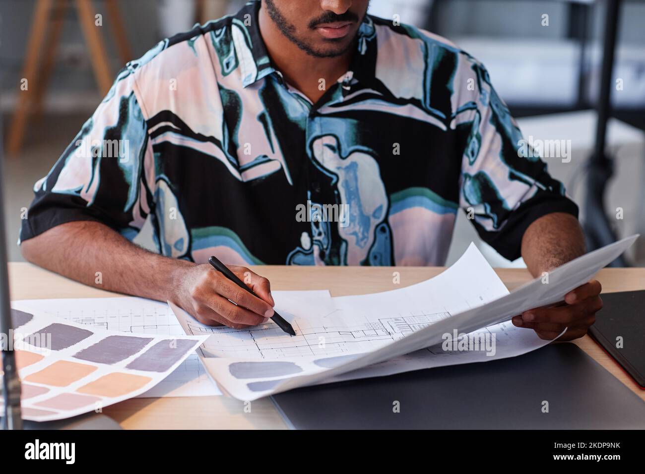 Close up of male interior designer working with color palettes and ...