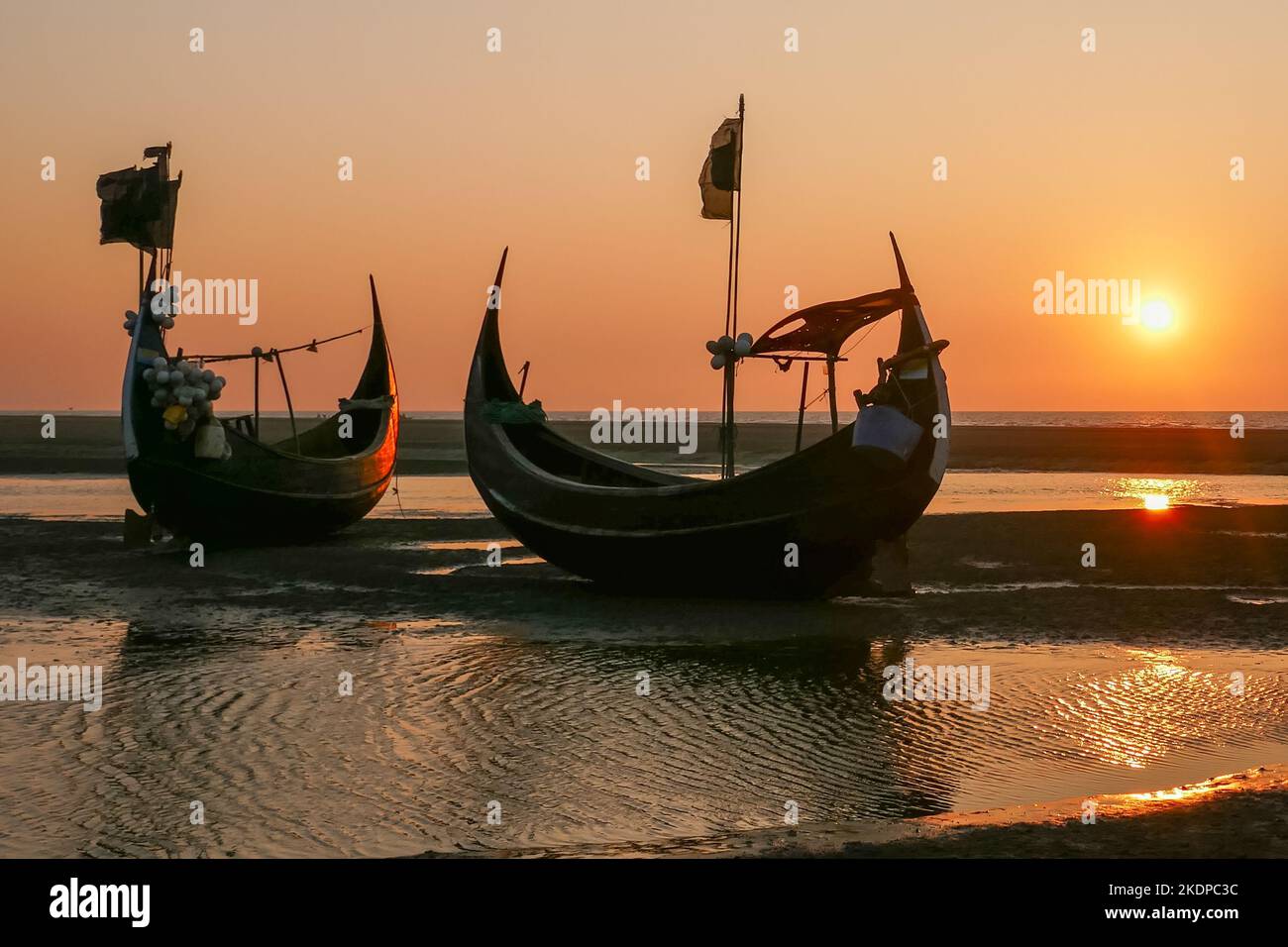 Landscape view at sunset of beautiful traditional wooden fishing boats ...