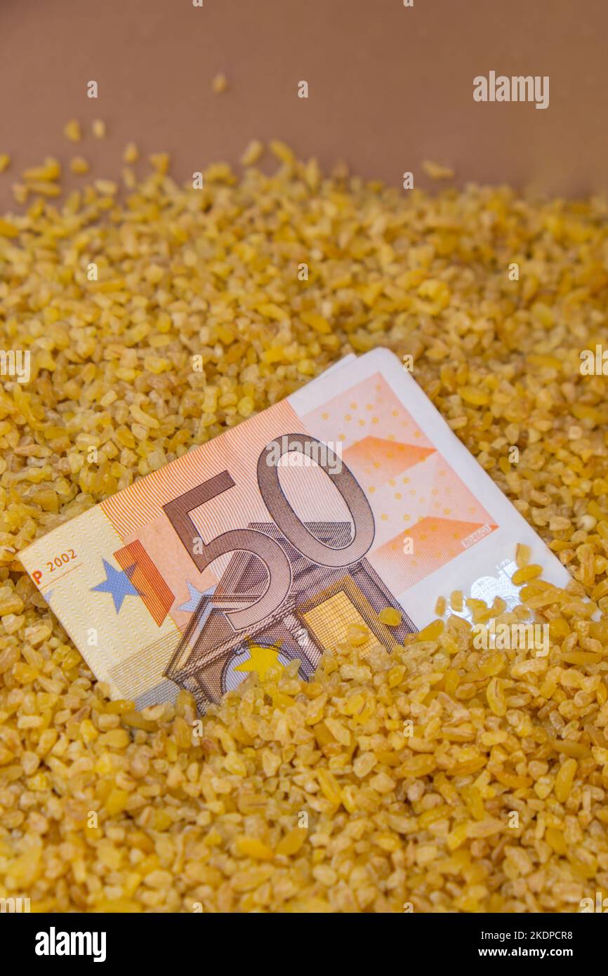 Euro bill paper money currency banknote in buckwheat porridge. The ...