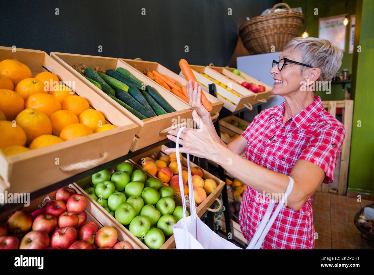 Mature woman shopping basket hi-res stock photography and images - Alamy