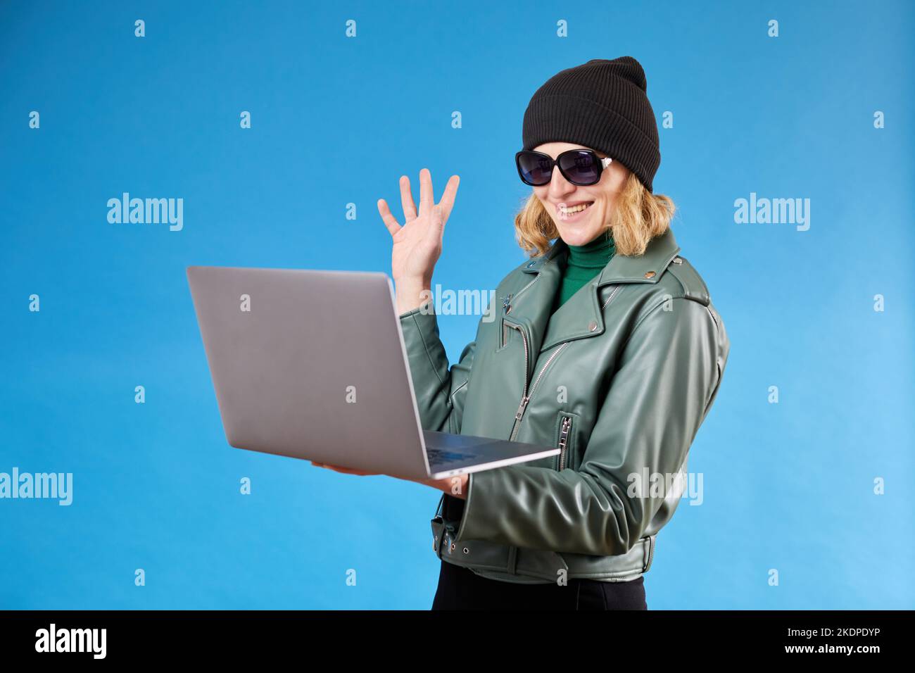 Hi! Beautiful woman with blonde hair waving hand, gesturing hello to ...