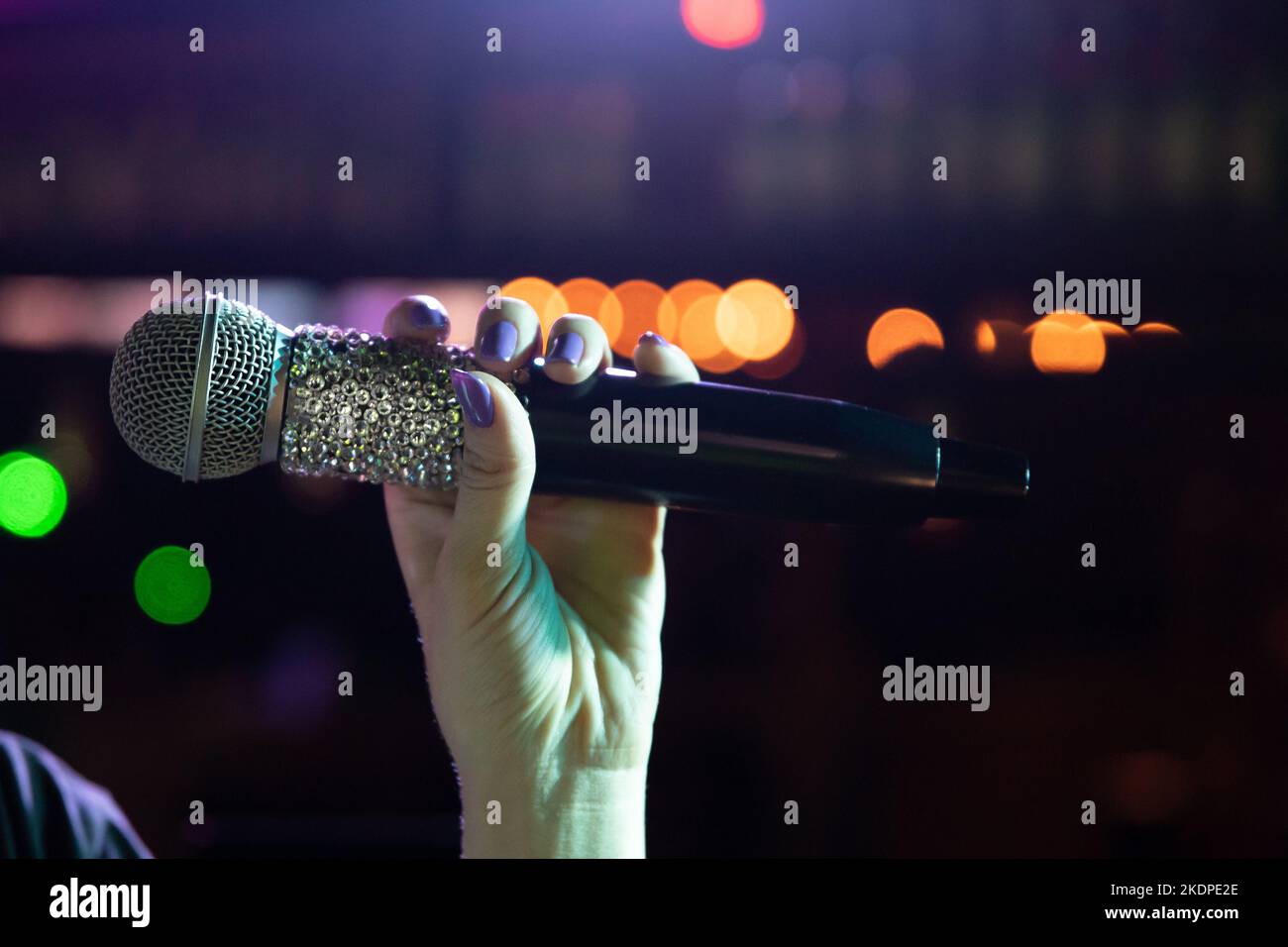 Hand holding microphone star hi-res stock photography and images - Alamy