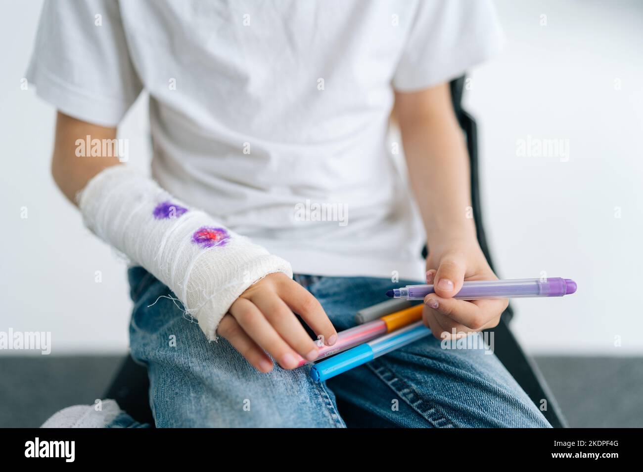 Close-up cropped shot of unrecognizable little girl drawing cute image ...