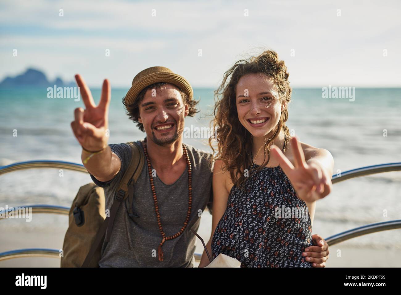Chilled vibes only. Portrait of a happy young couple showing peace ...