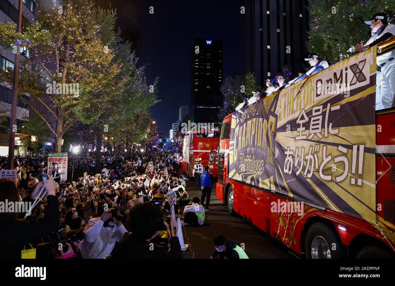 Orix Buffaloes players parade down Osaka's Midosuji street in western ...