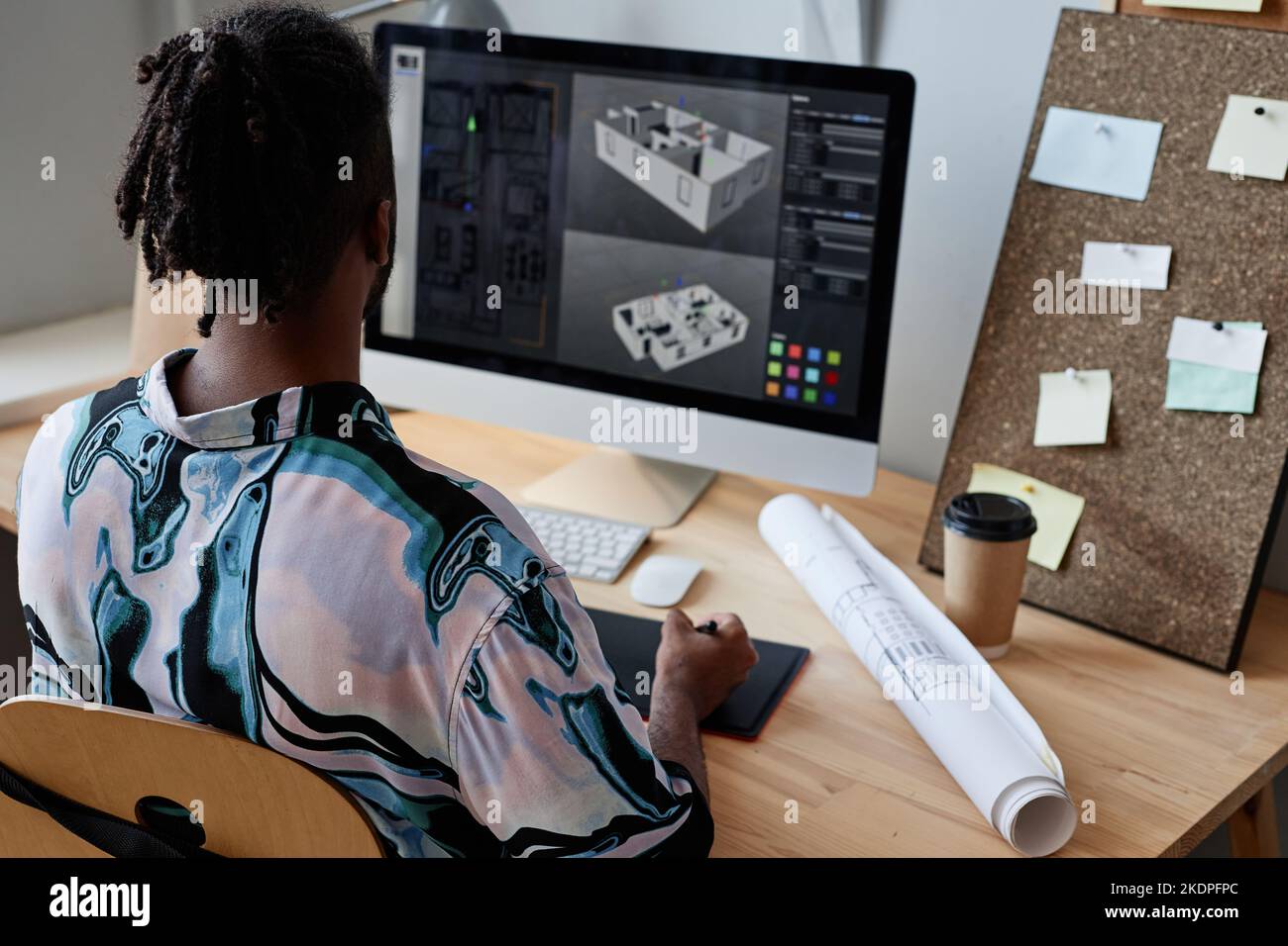 Back view of male digital designer creating 3D model of house at workplace, copy space Stock ...