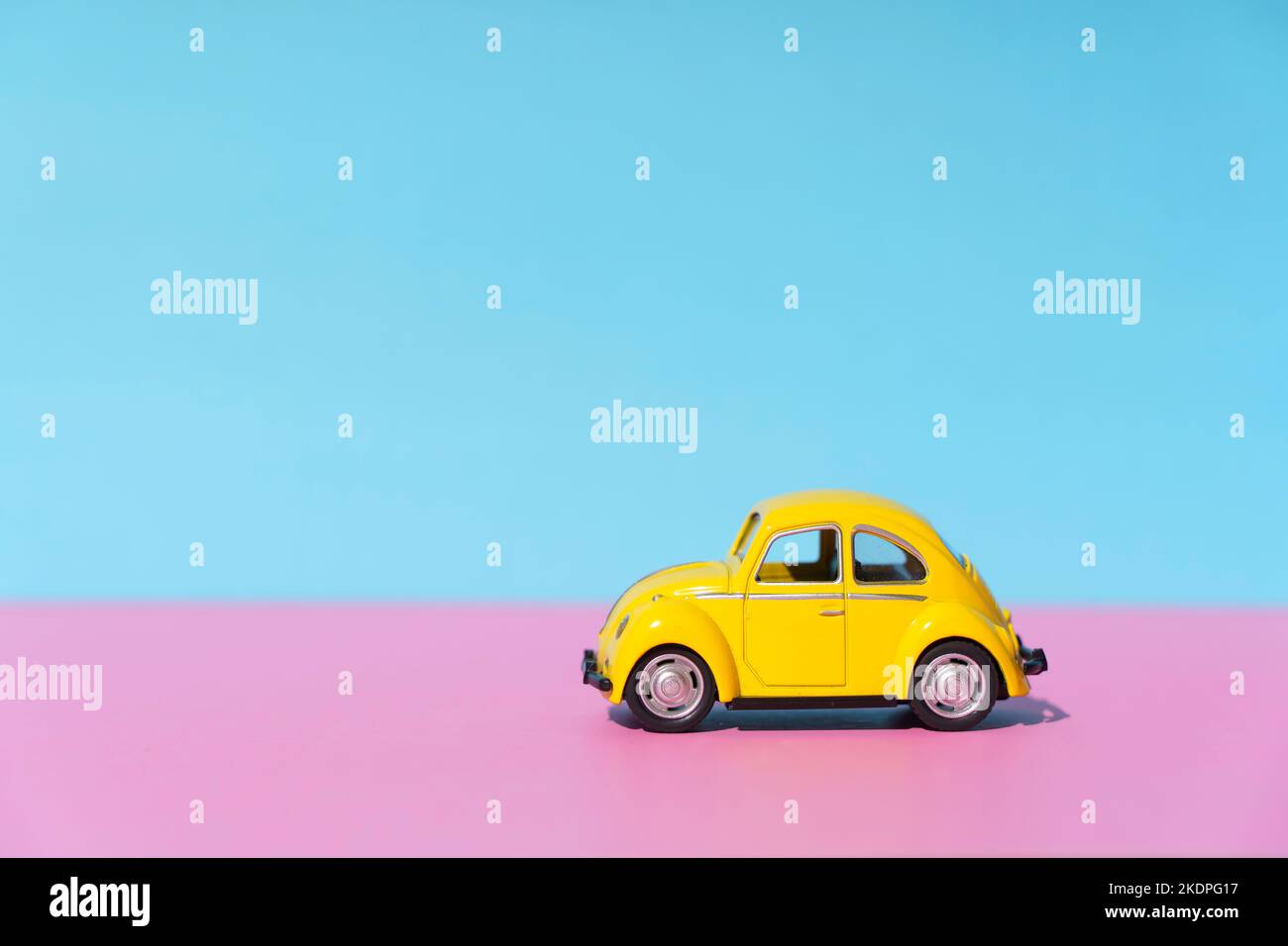 Travel car concept background. Yellow toy car on empty minimal pastel ...