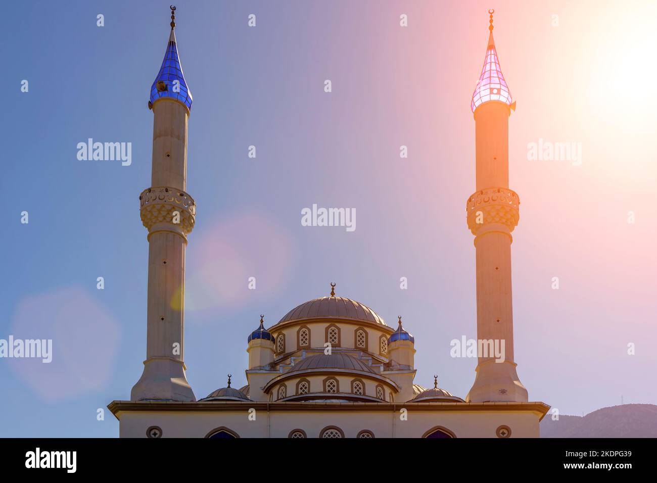Architecture of the Islamic mosque in Turkey against the sunny blue sky ...