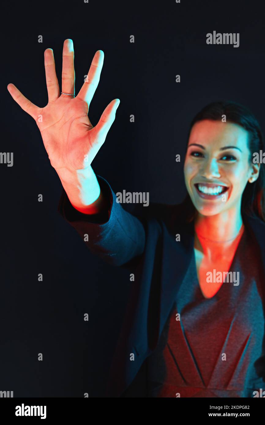 High five. Portrait of a young businesswoman showing a number with her ...