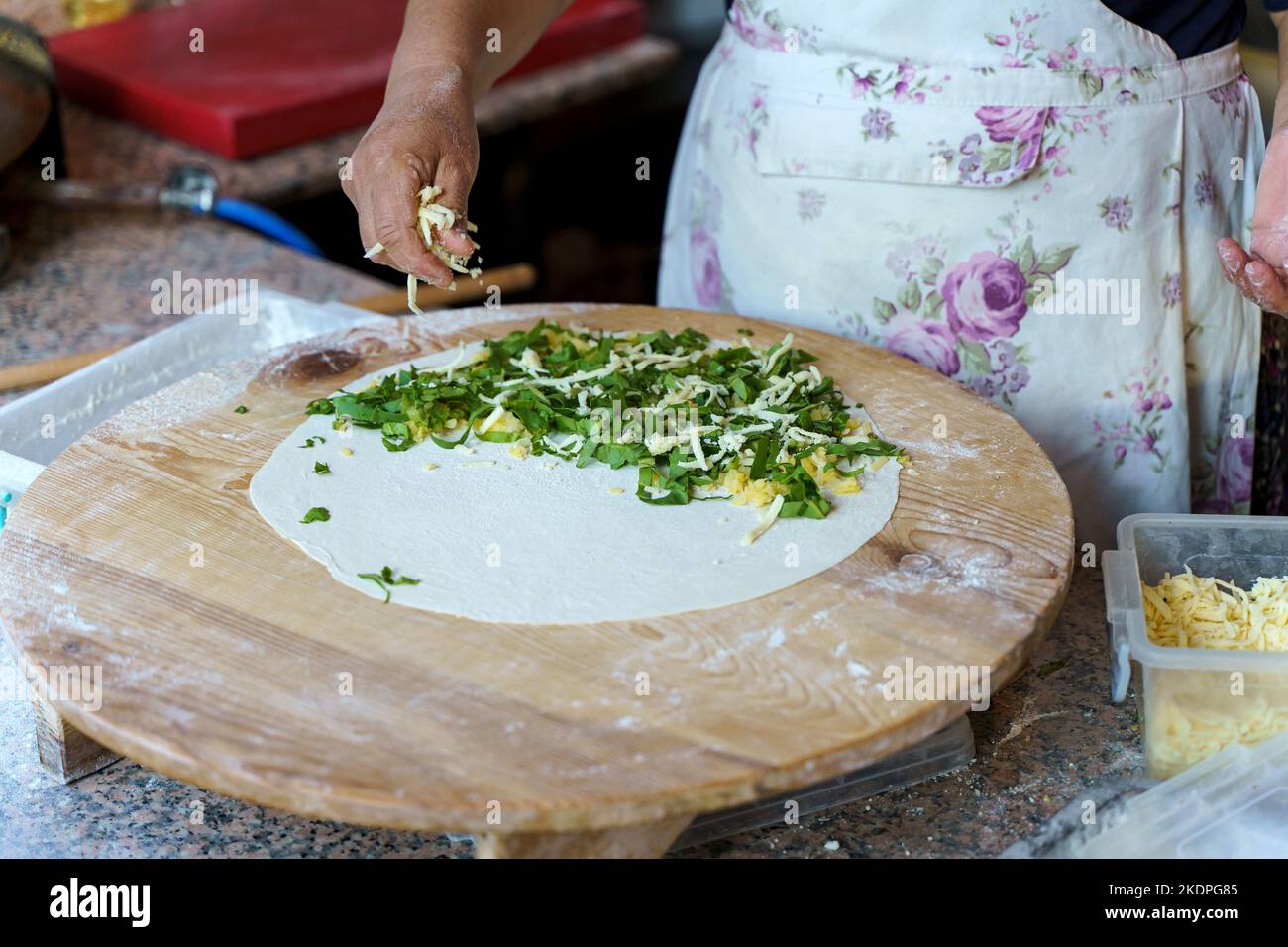 Turkish housewife cooking gozleme, traditional Turkish food cuisine ...