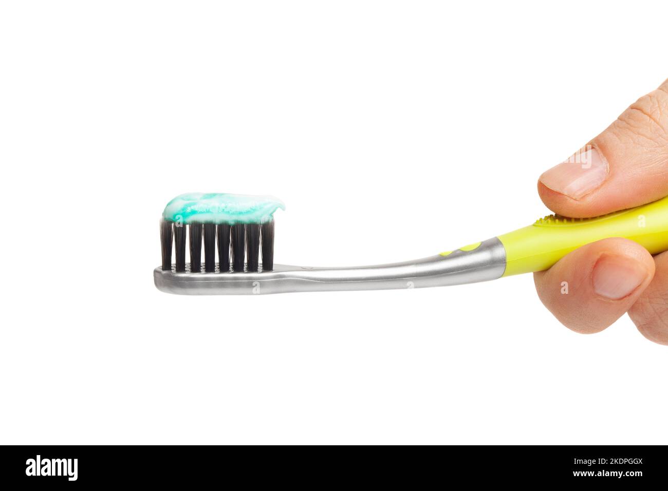 Female hand holding toothbrush with toothpaste isolated on white ...
