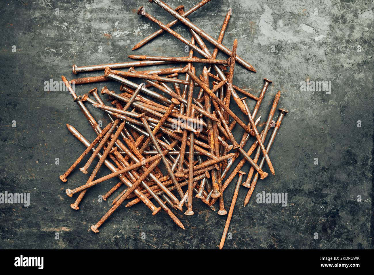 Rusty nails on steel surface. Tools for maintenance. Hardware tools to ...