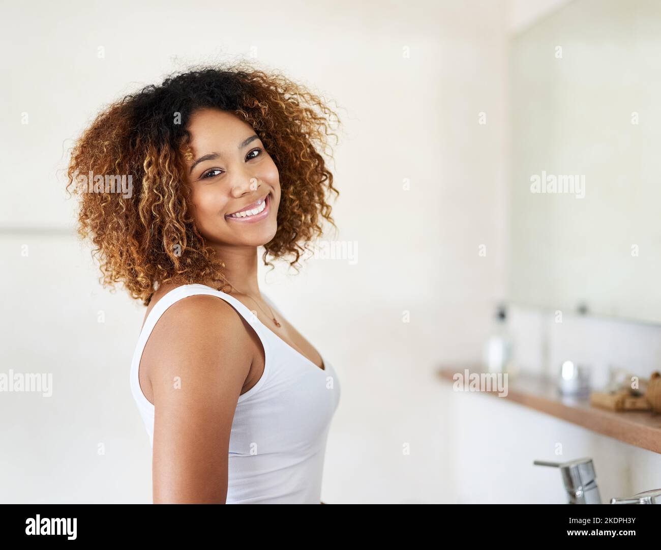 Im ready to start this day. an attractive young woman going through her ...