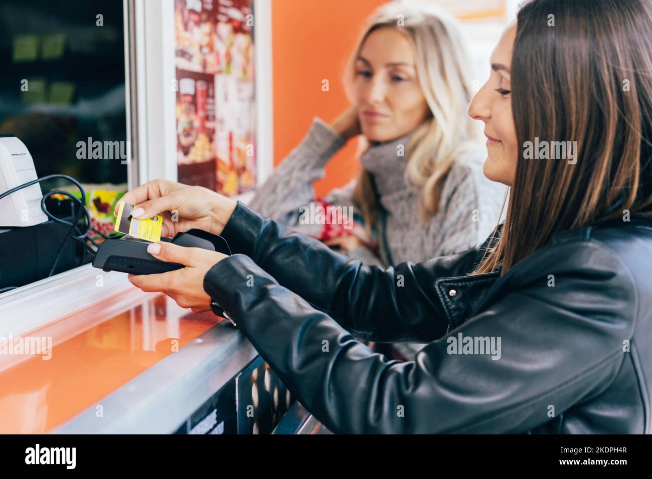Woman paying food order hi-res stock photography and images - Alamy