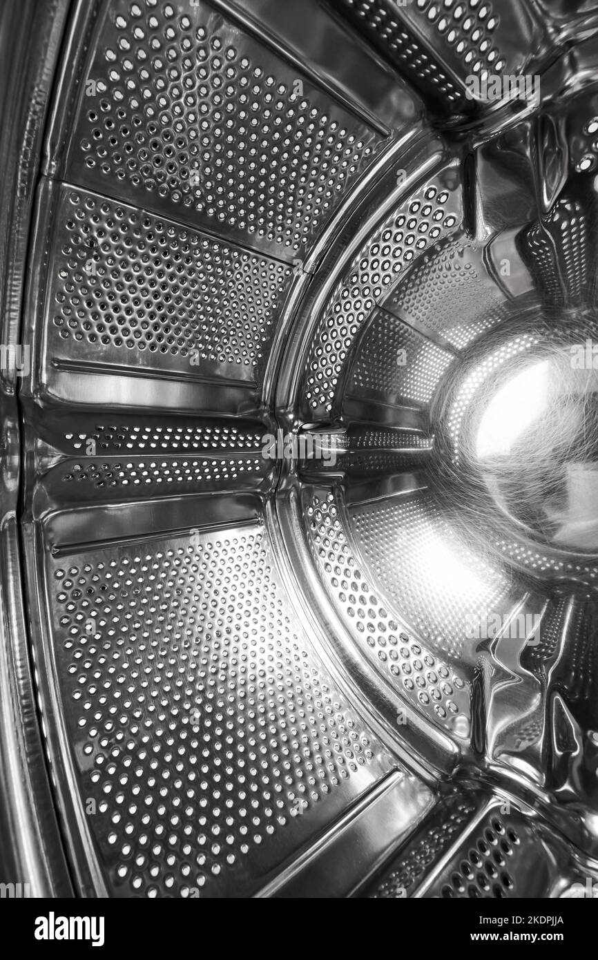 Close-up of inside of a steel washing machine drum Stock Photo - Alamy
