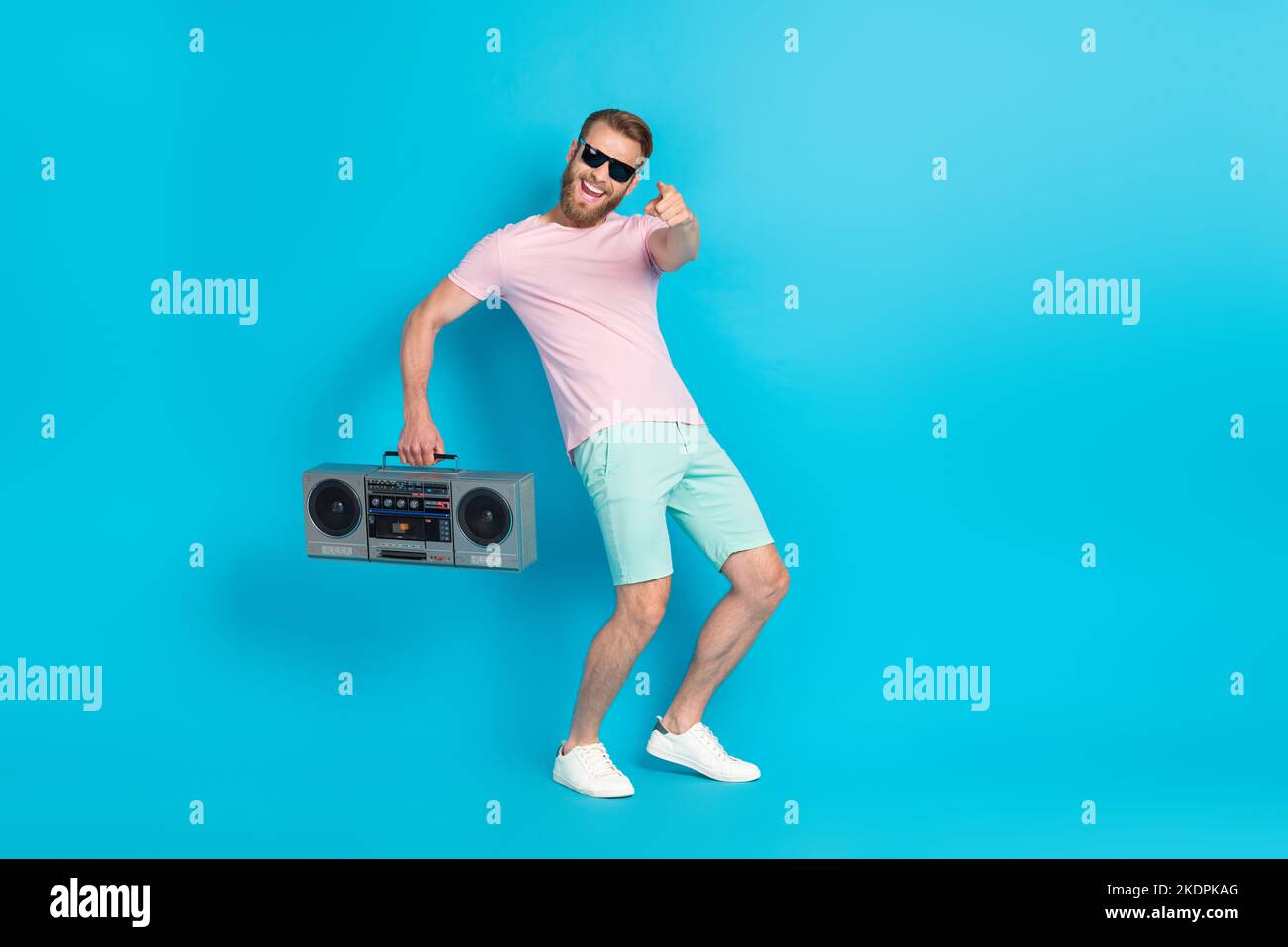 Full body photo of attractive young man point you energetic dancer dj ...