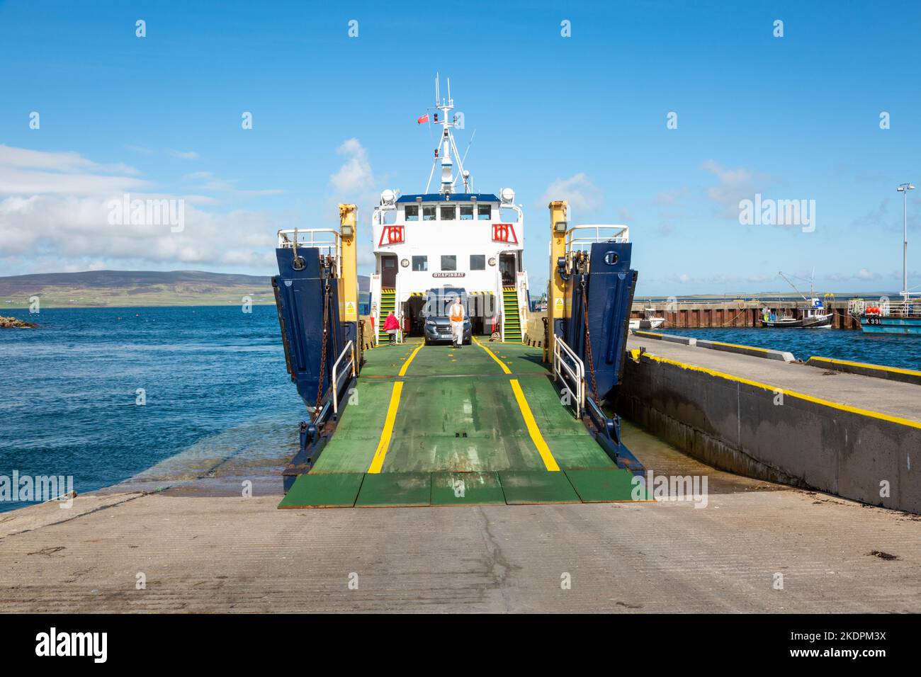 Passenger and vehicle ferry at an island port, Orkney Isands, UK, 2022 ...