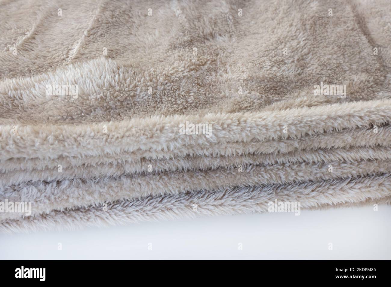 New folded brown fleece throw blanket, fabric closeup, copy space Stock ...