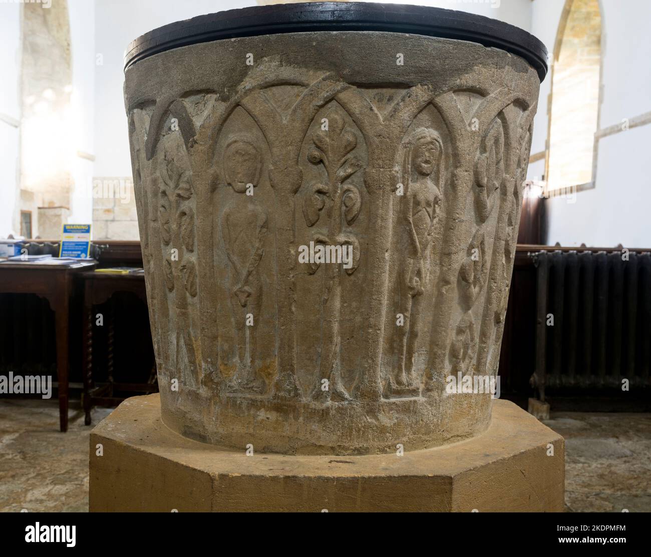 The font with Adam and Eve carvings, St. Laurence`s Church, Oxhill ...