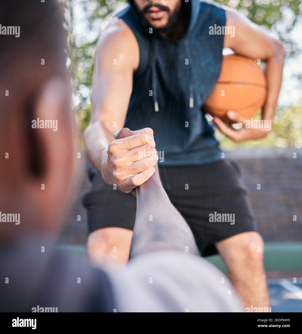 Hands, basketball and help with a man athlete and rival playing a ...